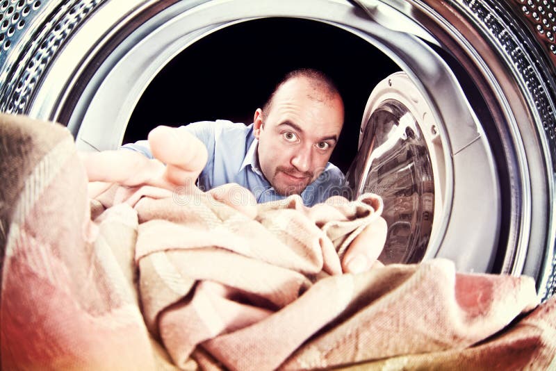 Man and washing machine stock photo. Image of household - 27219594