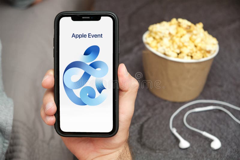Man is Watching Apple Event 2020 Using IPhone. Apple Logo on the Device ...