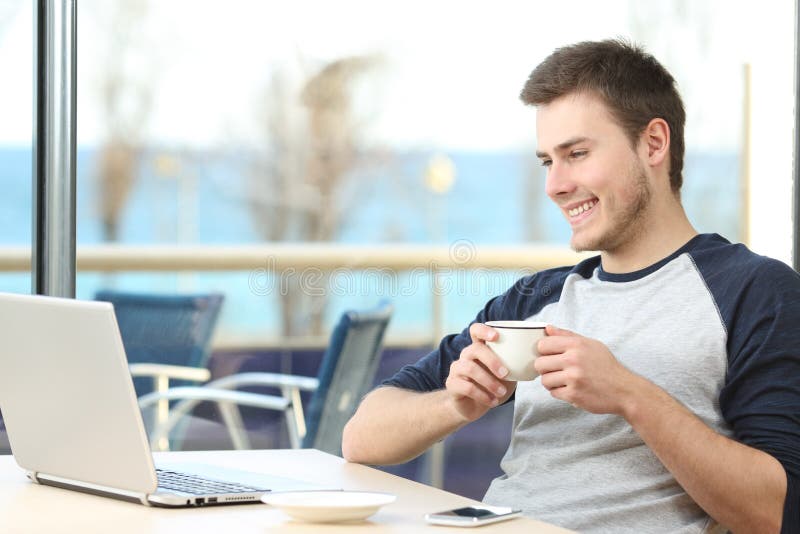 Man Watching Content on Laptop on a Coffee Shop Stock Photo - Image of ...