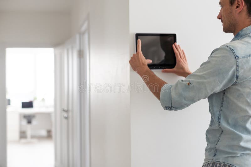 Man Watching Delivery Man on Security Camera Cctv Video on Tablet Stock ...