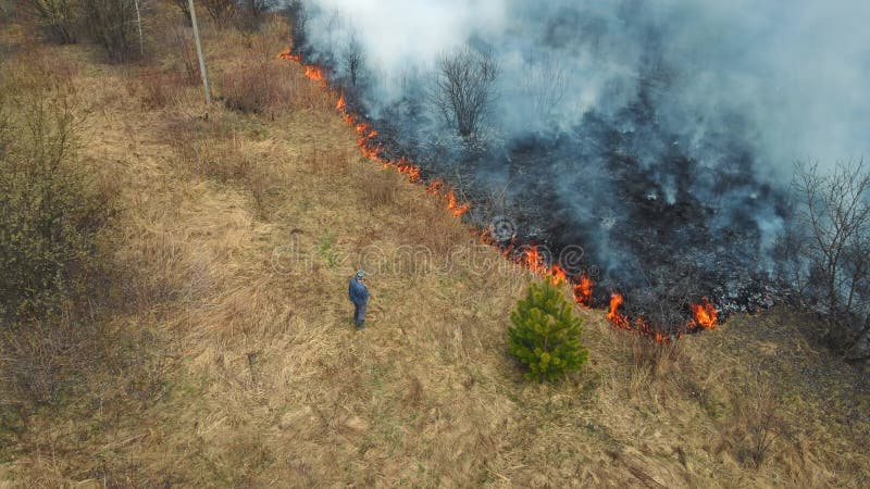 Man Watching the Fire. a Fire Approached the Houses. Forest Fire ...