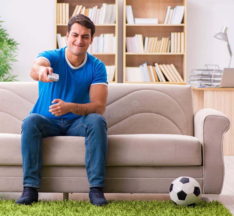 Man Watching Football at Home Sitting in Couch Stock Image - Image of ...