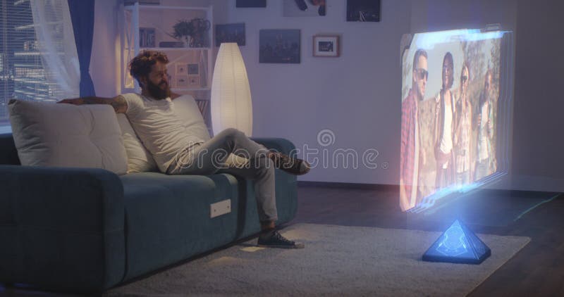 Man Watching Holographic TV at Night Stock Photo - Image of couch ...
