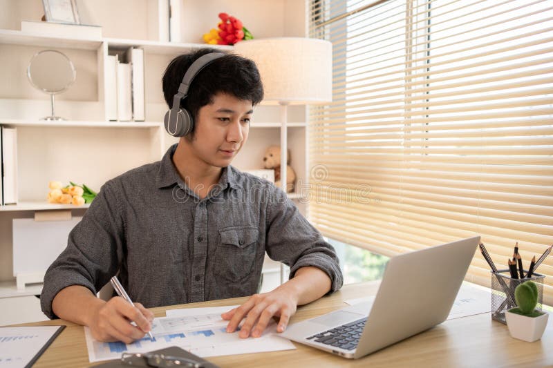 Man Watching Live Video or Video Call of Teacher Teaching on Laptop in ...