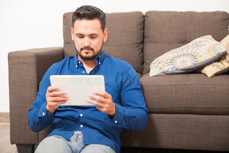 Man Watching the News on a Tablet Computer Stock Image - Image of home ...
