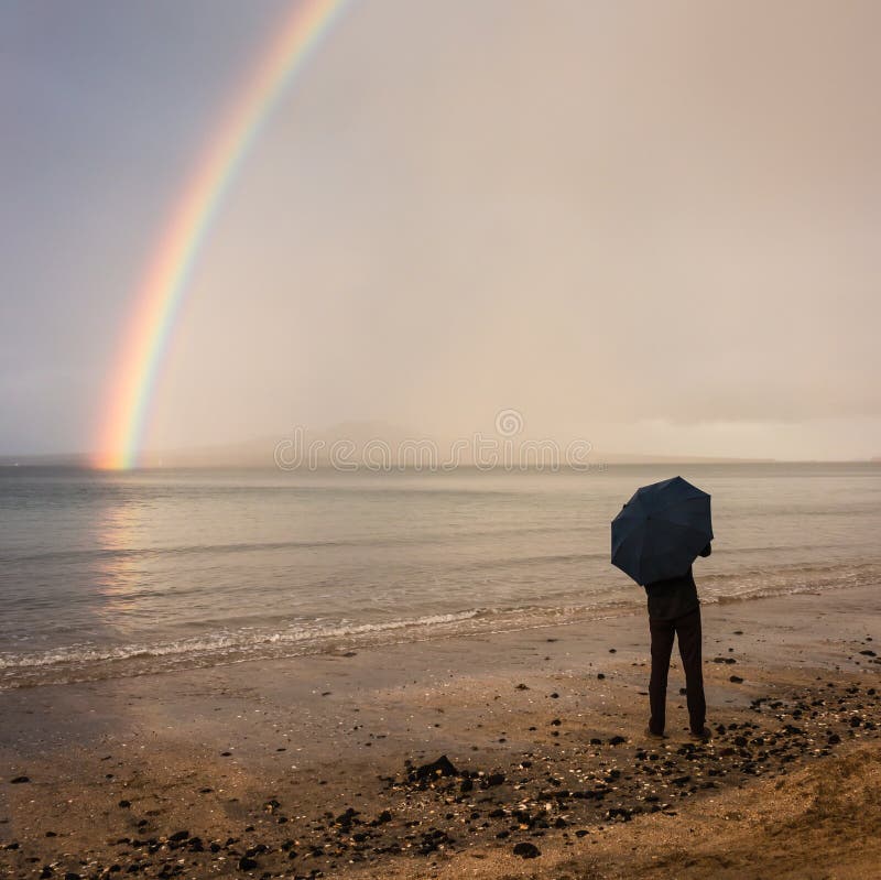 Watching in Awe, Rainbow in the Spray Off Seljalandsfoss Waterfall ...