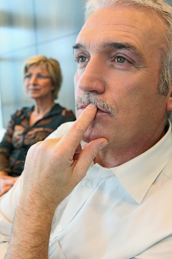 Man Watching Something Thoughtfully Stock Image - Image of people ...