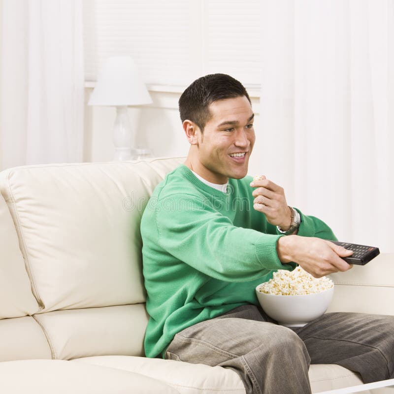 Man Watching Television stock image. Image of latin, apartment - 9913311