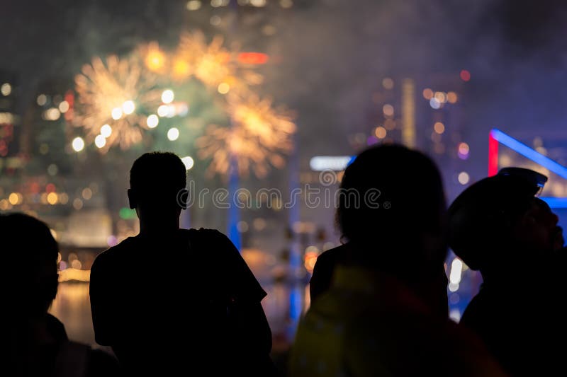Man Watching the 4th of July Fireworks Over Water Stock Image - Image ...