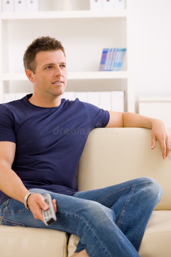 Man watching TV stock photo. Image of bored, seated, handsome - 16785624