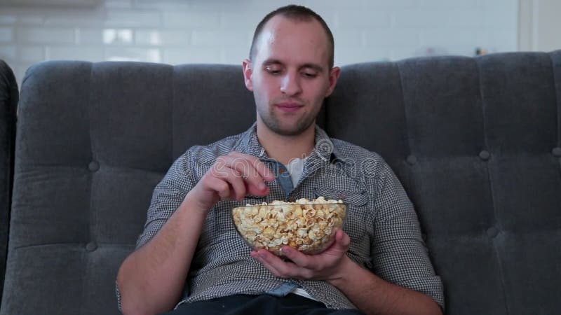 Man Watching TV and Eating Pop Corn Stock Video - Video of sofa, eating ...