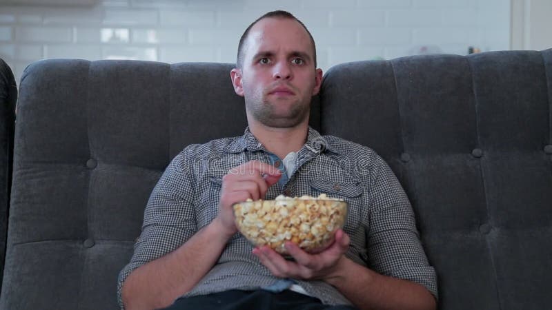 Man Watching TV and Eating Pop Corn Stock Video - Video of television ...