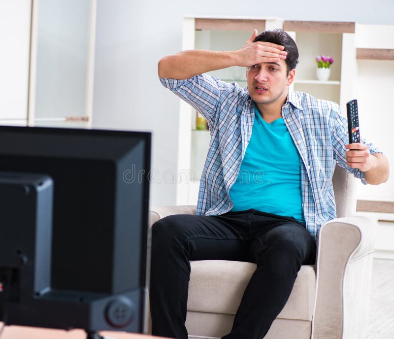 Man watching tv at home stock image. Image of media - 177951031