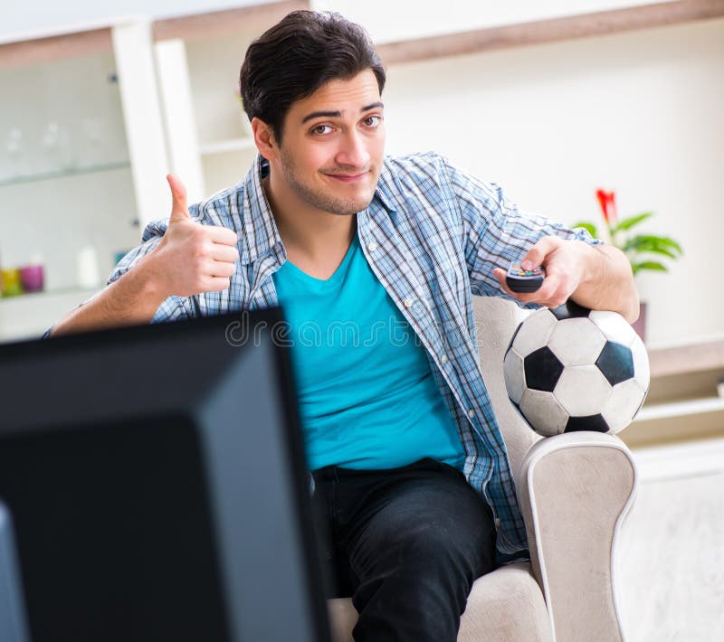 Man watching tv at home stock photo. Image of goal, enjoying - 224339736