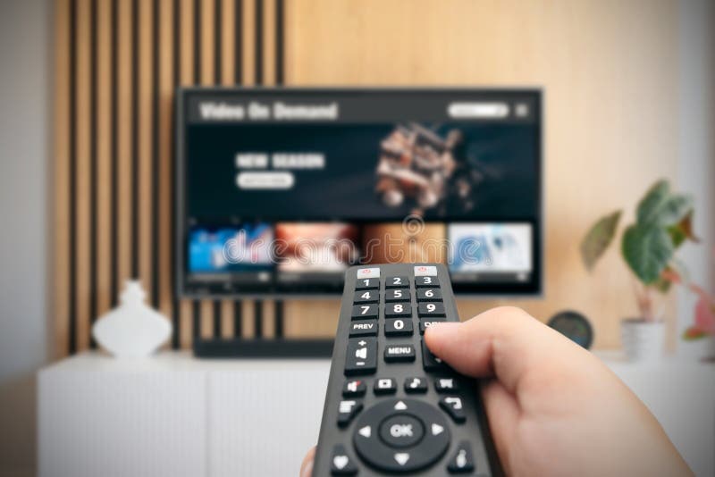 Man Watching TV with Remote Control in Hand Stock Image - Image of ...