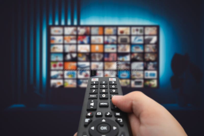 Man Watching TV with Remote Control in Hand Stock Image - Image of ...