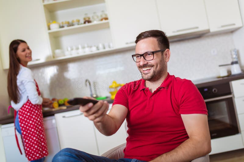 Man Watching Tv Women Preparing Meal Kitchen Stock Photos - Free ...