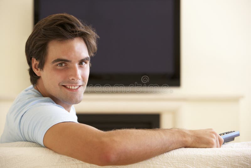 Man Watching Widescreen TV at Home Stock Photo - Image of sitting ...