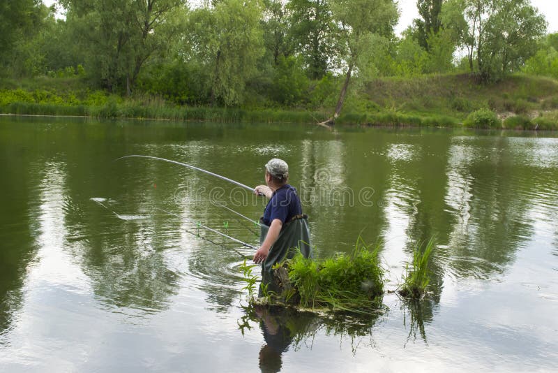 Man in the Water is Fishing Editorial Image - Image of season, water ...