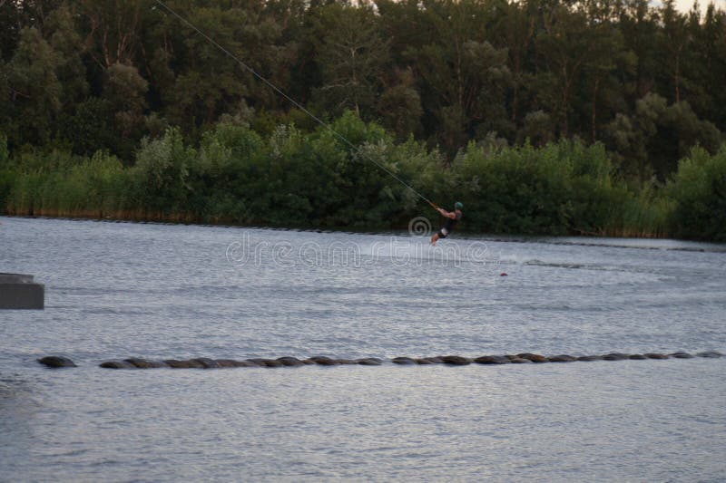 A Man is Water Skiing at Sunset. Editorial Stock Image - Image of ...