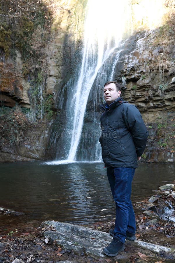 Man and waterfall stock image. Image of river, hill - 171586423