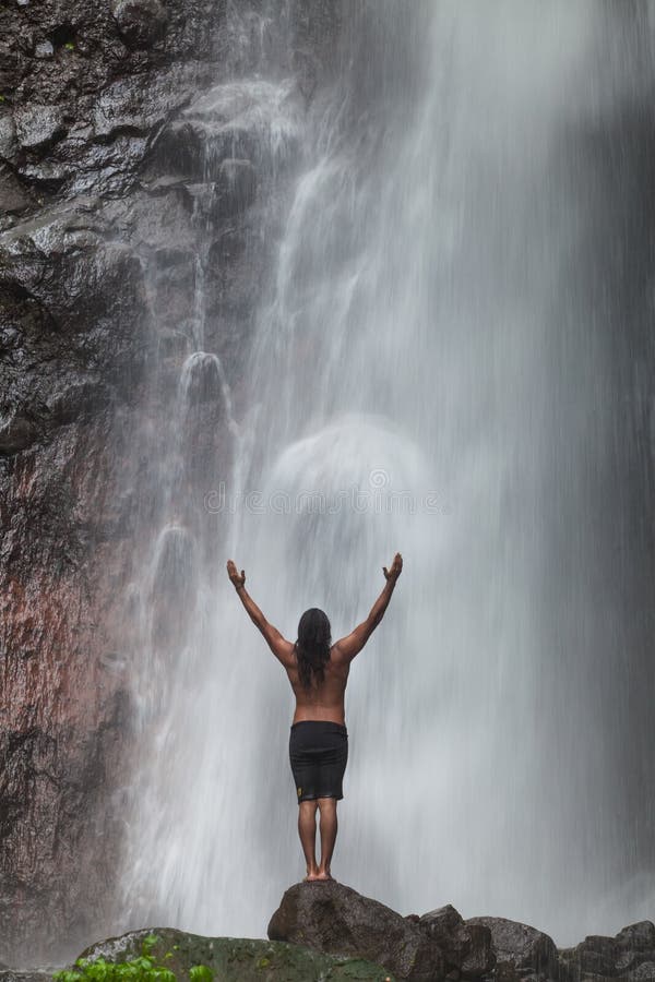 Man at waterfall stock photo. Image of forest, hands - 33323270