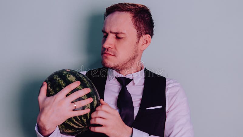 A Man and a Watermelon / Boy in Classic Suit with a Watermelon Stock ...