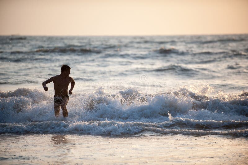 Man and waves stock image. Image of looking, energy, water - 66421707