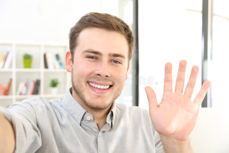 Handsome Man Using Smart Phone Video Call Waving Hand Stock Photos ...