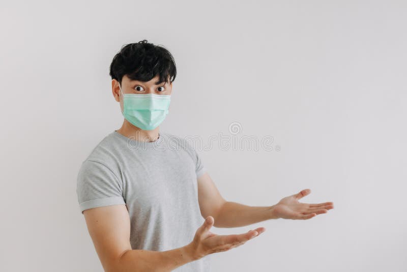 Man Wear Mask and Present Empty Space for Advertisement. Stock Photo ...