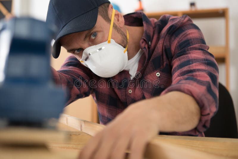 Man Wearing Dust Mask To Use Sander Stock Image - Image of close ...