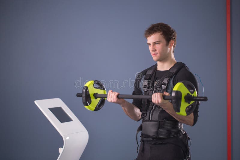 Man Working Out EMS Training with Barbell Closeup, Power Pose Stock ...