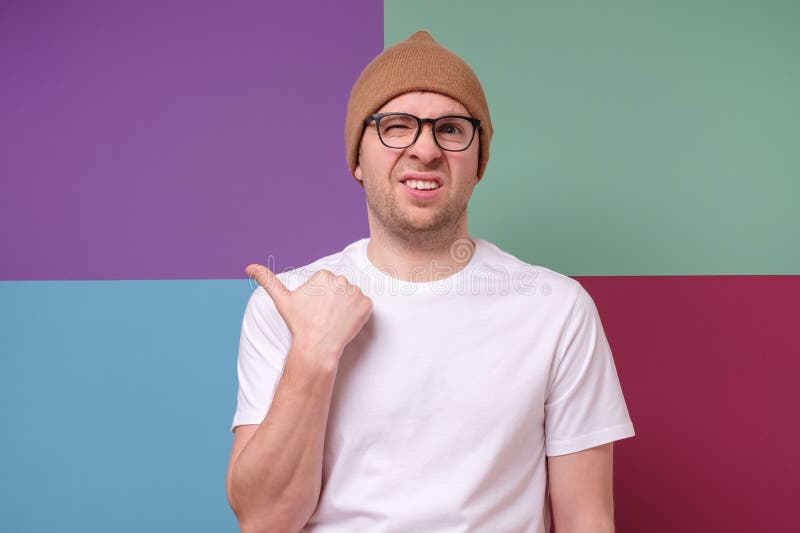 Man Wearing Glasses Points Finger Aside at Questionable Distrustful ...