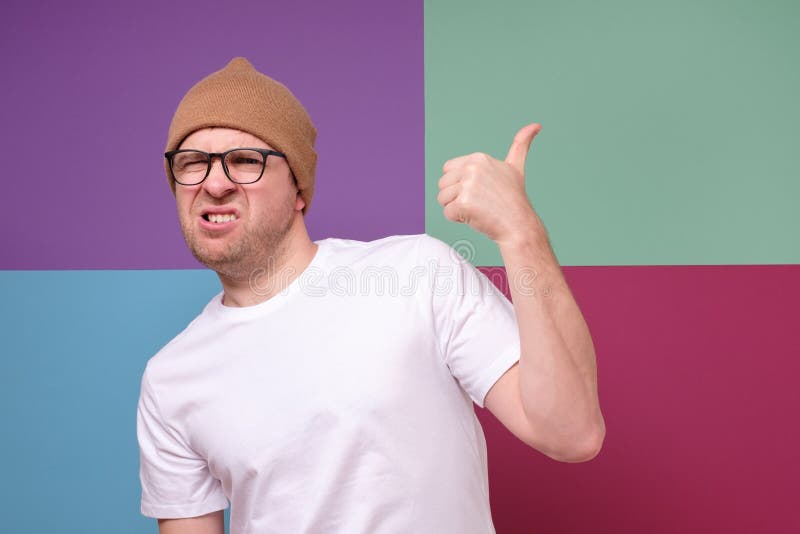 Man Wearing Glasses Points Finger Aside at Questionable Distrustful ...