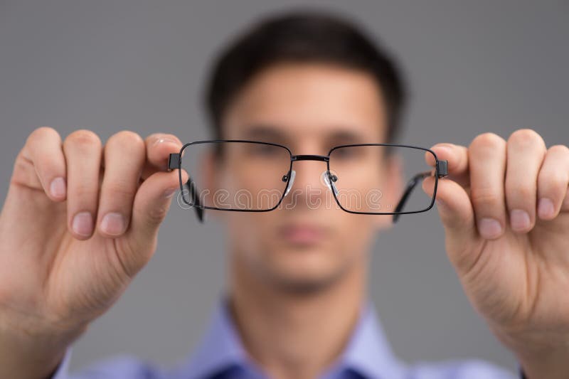 A Man Wearing Glasses To Improve Vision. Stock Photo - Image of macro ...