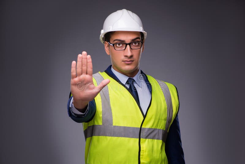 The man wearing hard hat and construction vest - Stock Image - Everypixel