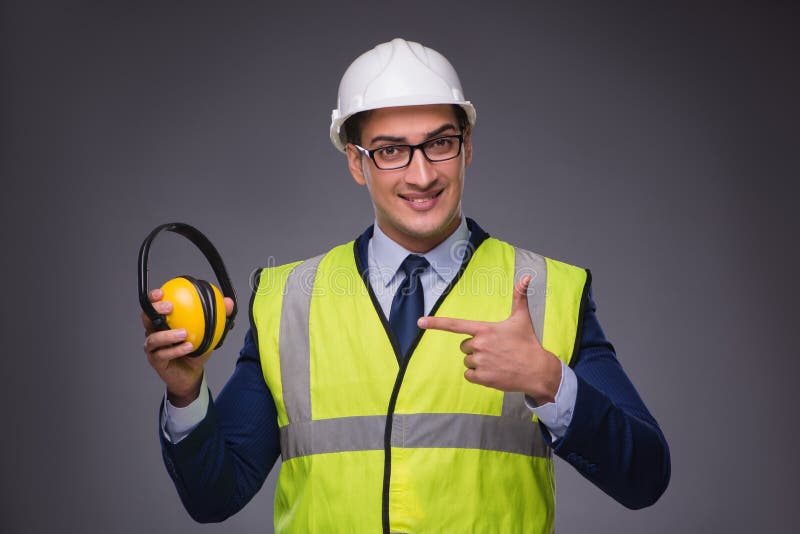 The Man Wearing Hard Hat and Construction Vest Stock Image - Image of ...
