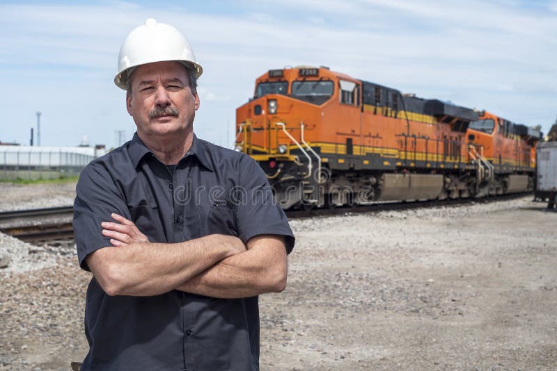 Man Wearing Hard Hat Standing in Front of Train Locomotive Engine in ...