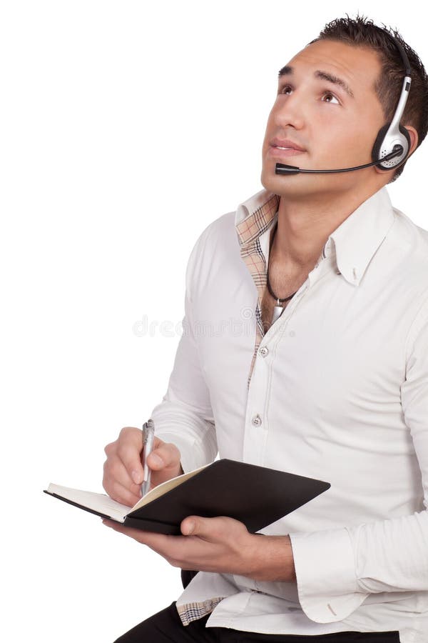 Man Wearing a Headset Taking Notes Stock Photo - Image of contemplation ...