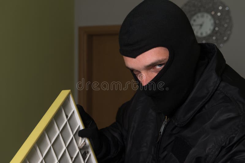 Man Wearing a Mask Robbed a Jewelry Store Stock Photo - Image of broken ...
