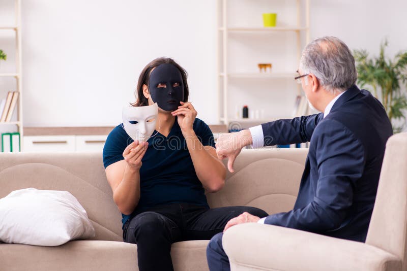 Young Man Wearing Masks during Psychotherapy Session Stock Photo ...