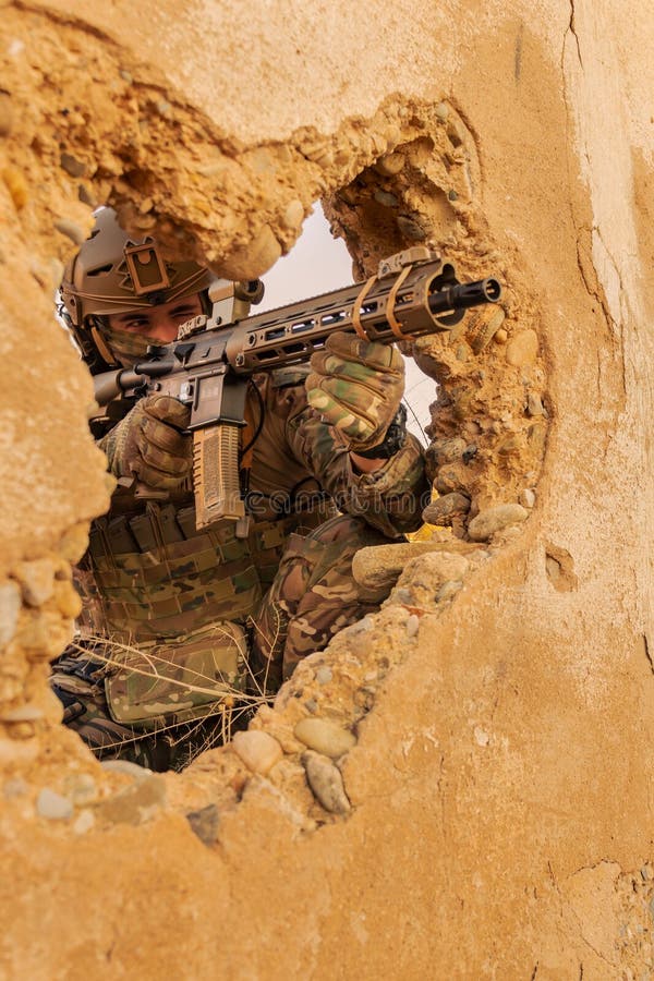 Man Wearing a Military Uniform with a Rifle Stock Photo - Image of ...