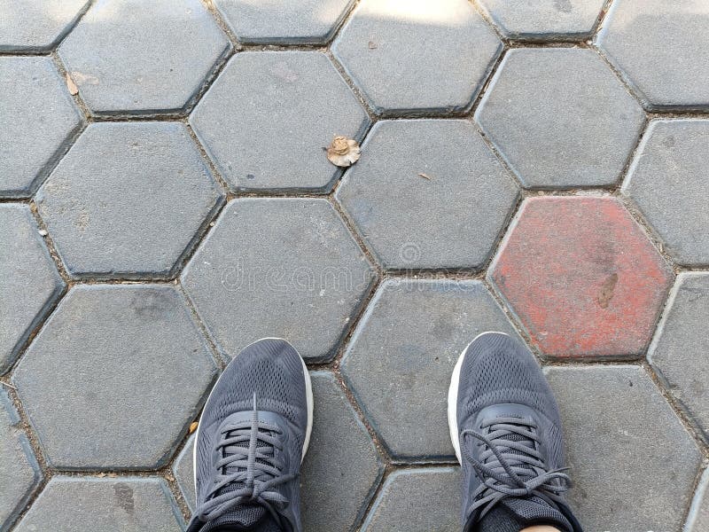 Man Wearing Shoes Standing on Cement Block Floor Stock Photo - Image of ...