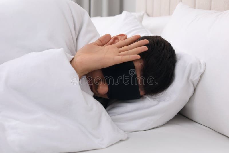Man Wearing Sleeping Mask in Bed at Home Stock Photo - Image of bedroom ...