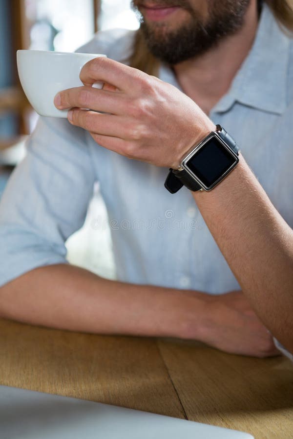 Man Wearing Smart Watch while Having Coffee in Cafe Stock Photo - Image ...