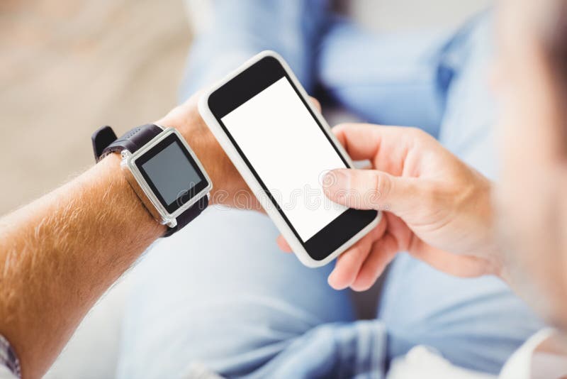 Man Wearing Smart Watch and Using Smartphone Stock Photo - Image of ...