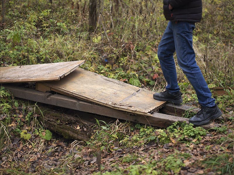 Man crossing a ditch stock image. Image of bridge, crossing - 201056475