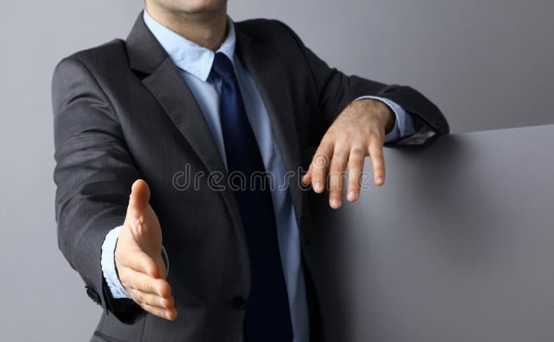 Man Wearing a Suit Offering To Shake Hands Stock Photo - Image of ...