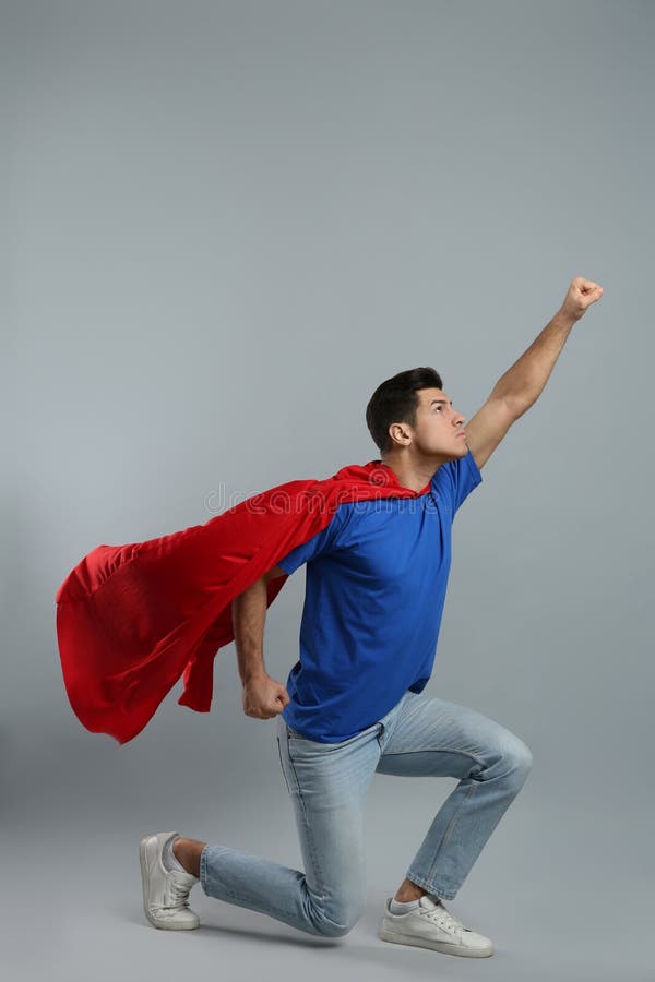 Man Wearing Superhero Cape on Grey Background Stock Image - Image of ...