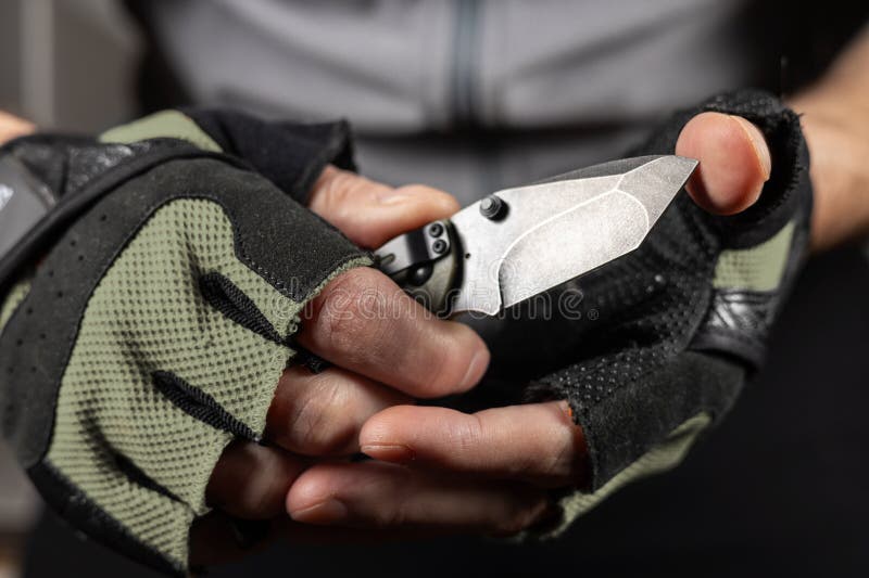 The Man Wearing Tactical Gloves Using Folding Knife Stock Image - Image ...